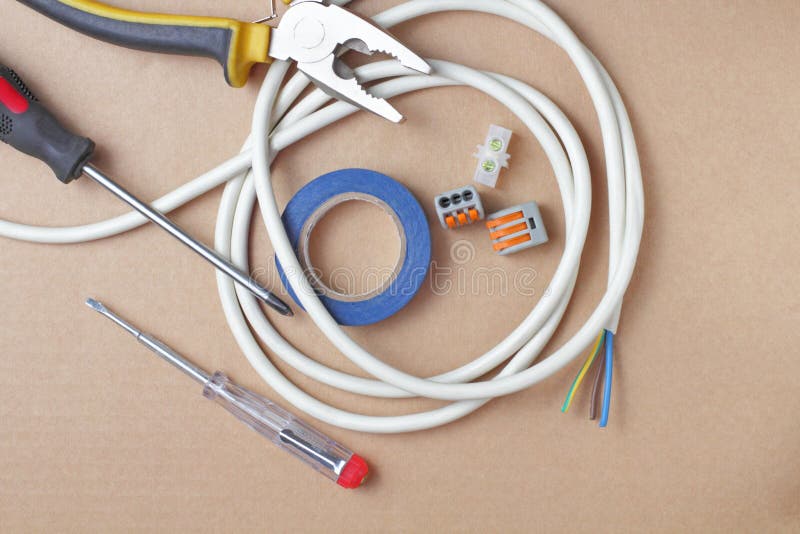 Electrician Tools and Wires on Craft Background, Flat Lay. Stock Image ...