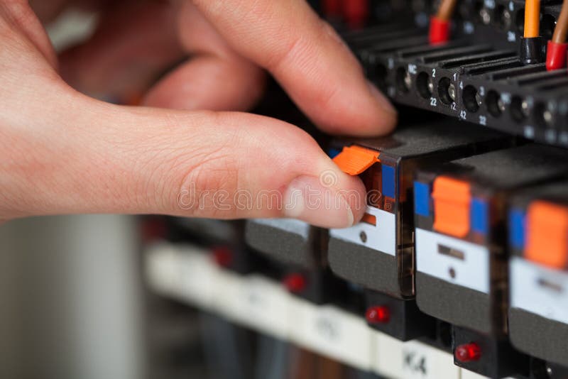 Electrician Turning on Switch in Fusebox Stock Image - Image of focus ...
