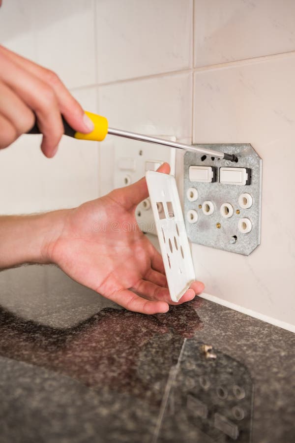Electrician Unscrewing Face Plate of Plug Socket Stock Photo - Image of ...