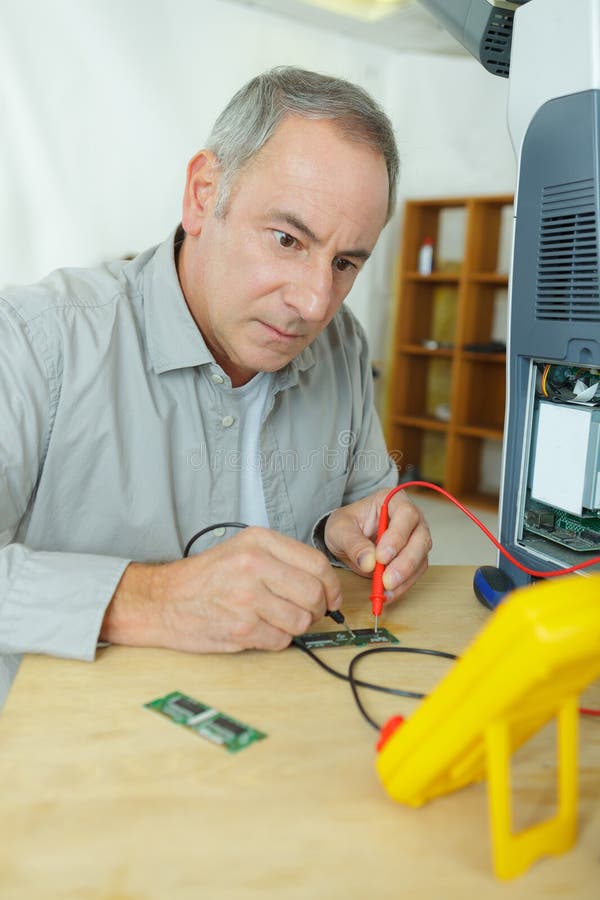 Electrician Using Digital Multimeter To Check Electric Systems Stock ...