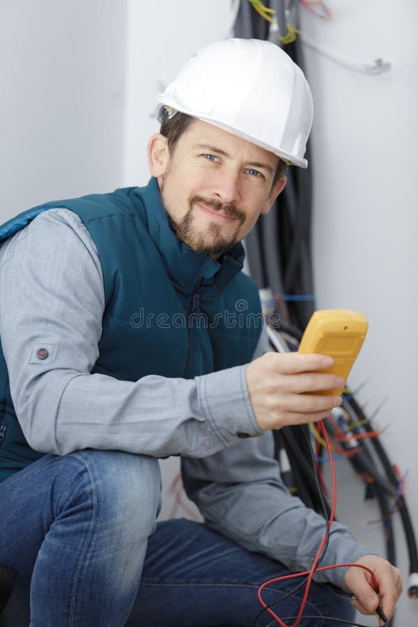 Electrician Using Multimeter in Renovation Property Stock Image - Image ...