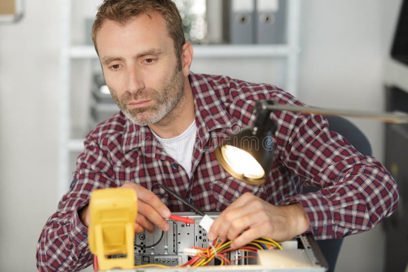 Electrician Using Multimeter To Test Computer Stock Image - Image of ...