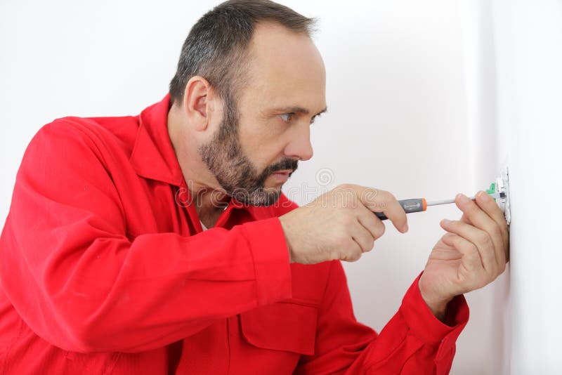 Electrician Using Screwdriver on Plug Socket Stock Image - Image of ...
