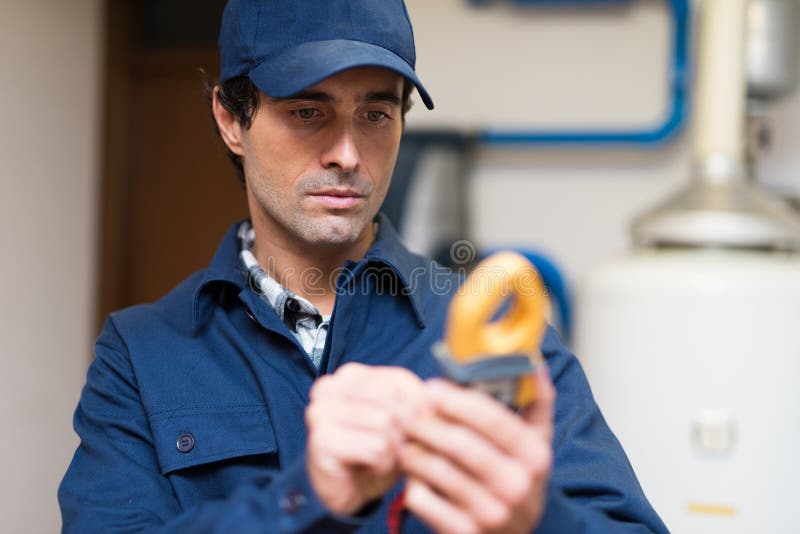 Electrician Using a Tester at Work Stock Photo - Image of handyman ...
