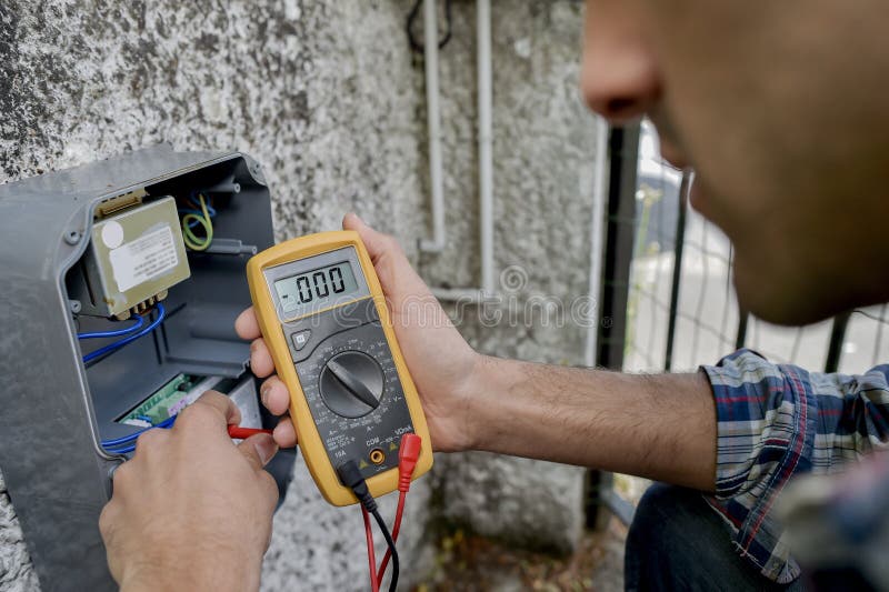 Electrician Using Voltmeter Stock Photo - Image of measurement ...