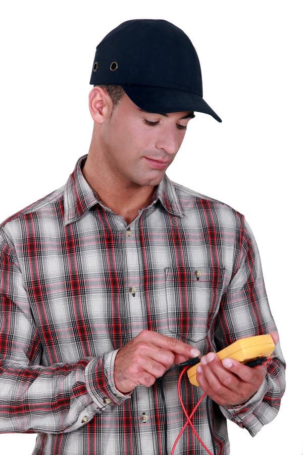 Electrician wearing a cap stock photo. Image of impedance - 31379750