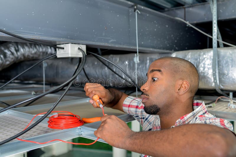 Electrician wiring cables stock photo. Image of handyman - 281819898