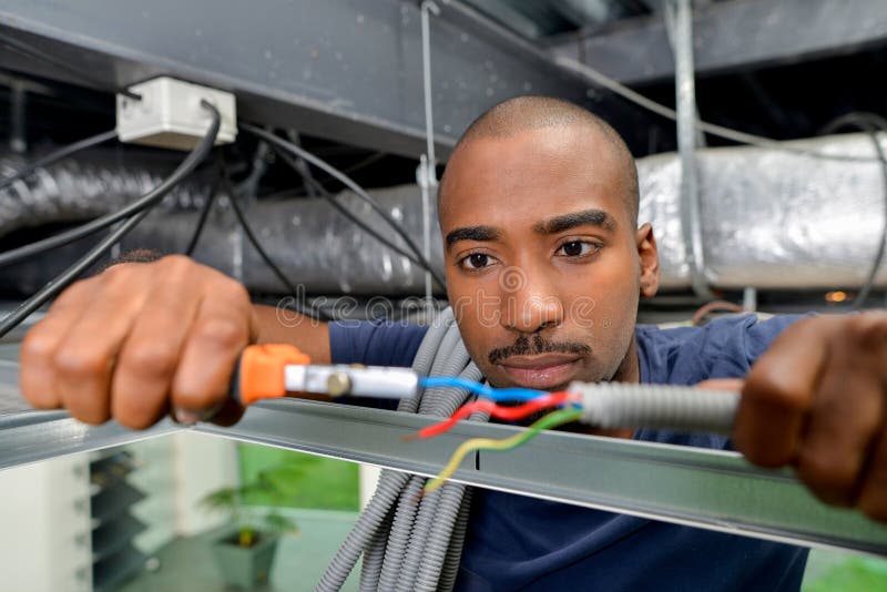 Electrician at work stock image. Image of exposed, install - 171369165