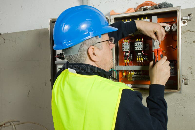 Electrician at work stock photo. Image of electricity - 79923380