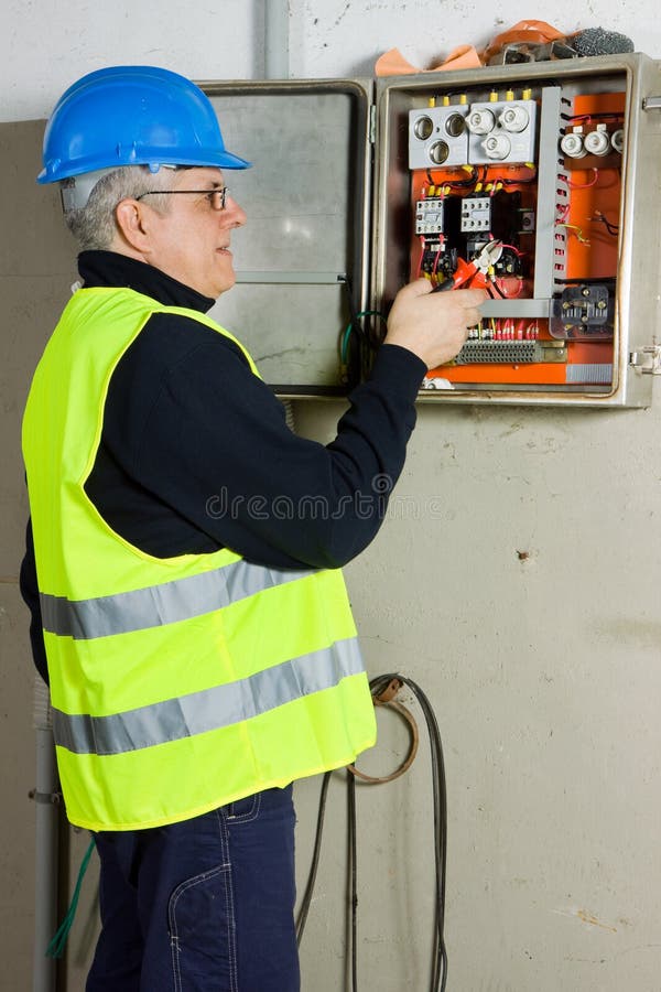Electrician at work stock image. Image of industry, pliers - 79923441