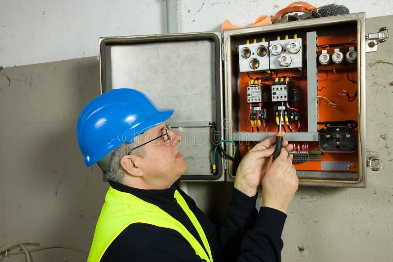 Electrician at work stock photo. Image of building, electricity - 79924068