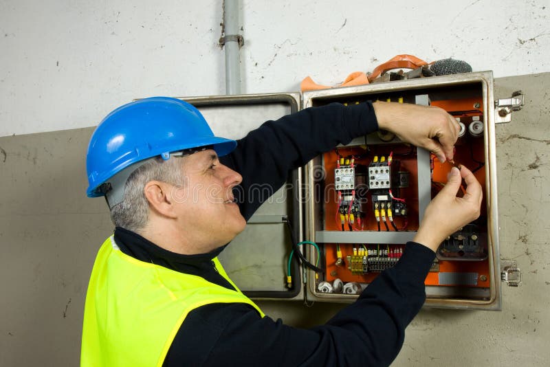 Electrician at work stock image. Image of hazardous, labor - 79924307
