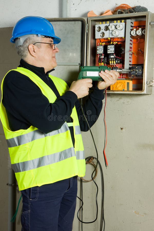 Electrician at work stock image. Image of licensed, electric - 79924537
