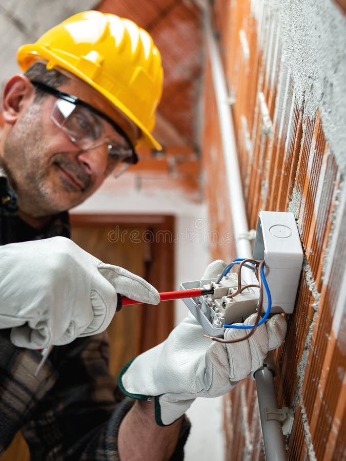 Electrician at Work in an Electrical System of a Construction Site ...