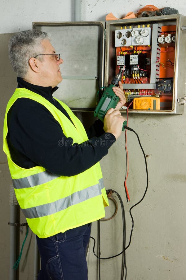 Electrician at work stock photo. Image of ground, electrical - 79923626