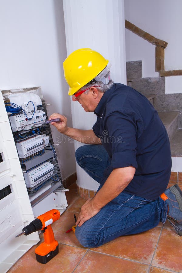 Electrician at work stock image. Image of laborer, checking - 68375953