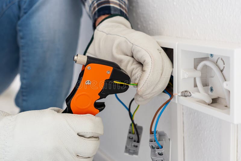 Electrician at Work on a Residential Electrical System. Electricity ...