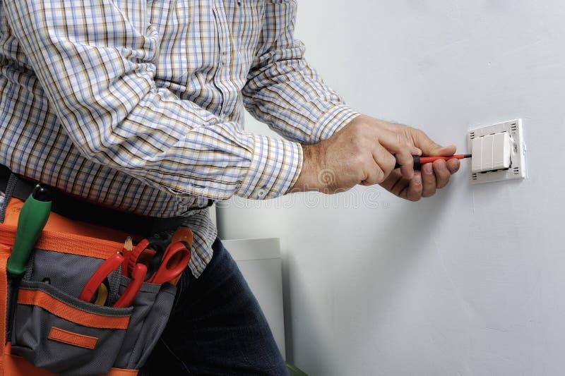 Electrician Working in a Residential Electrical System Stock Photo ...