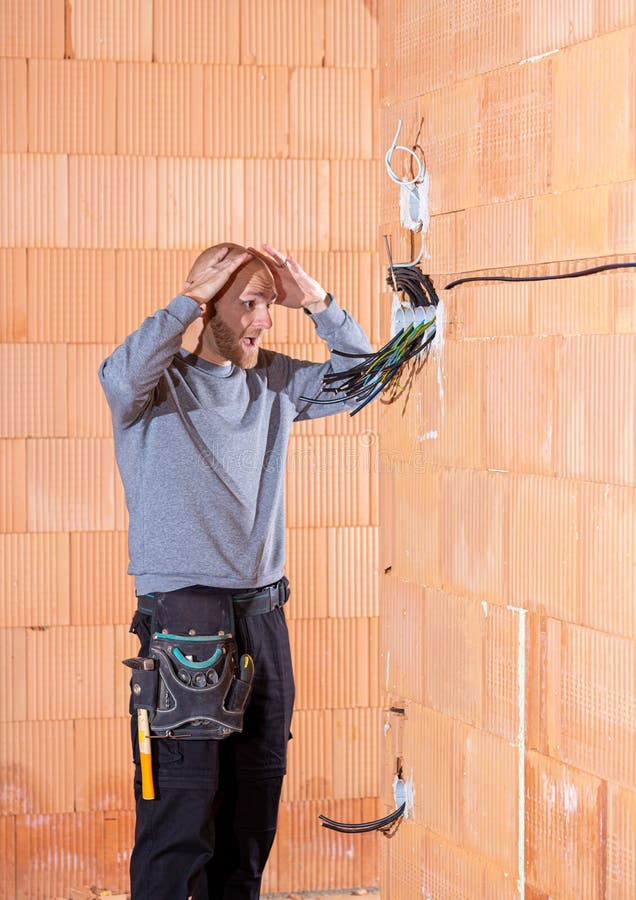 An Electrician at Work Thinking What Start To Install First in Sockets ...