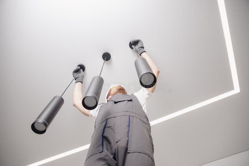 Electrician Worker Man Assembling Electric Lamps in New Apartment Stock ...