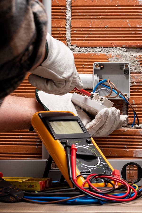 Electrician At Work On A Residential Electrical System. Electricity ...