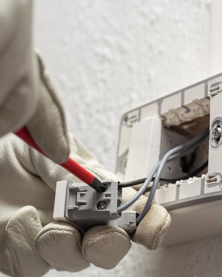 Electrician at Work on a Residential Electrical System. Electricity ...