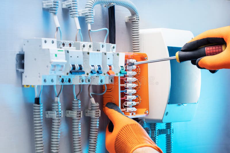 Electrician Worker at Work on an Electrical Panel. Stock Image - Image ...