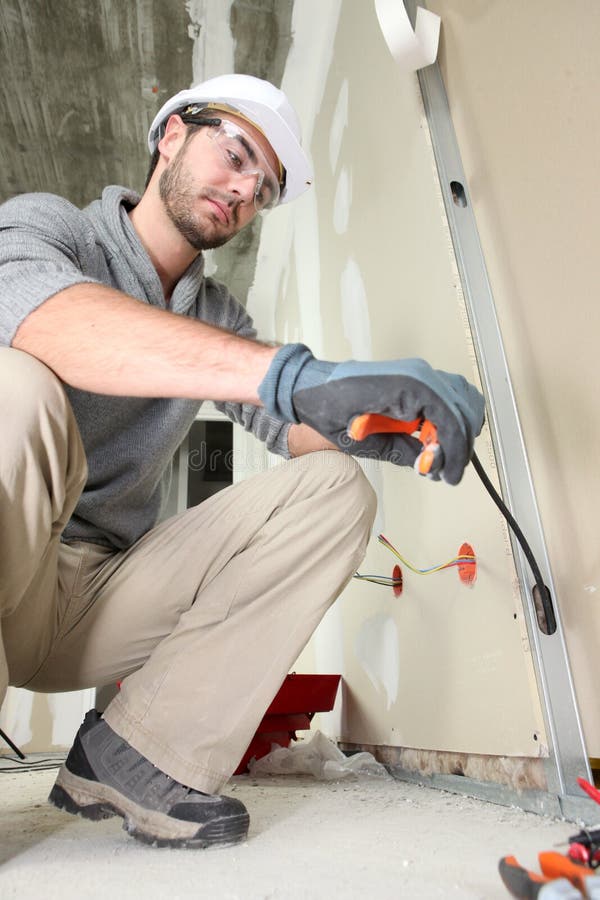 Electrician at Work stock image. Image of construction - 893713
