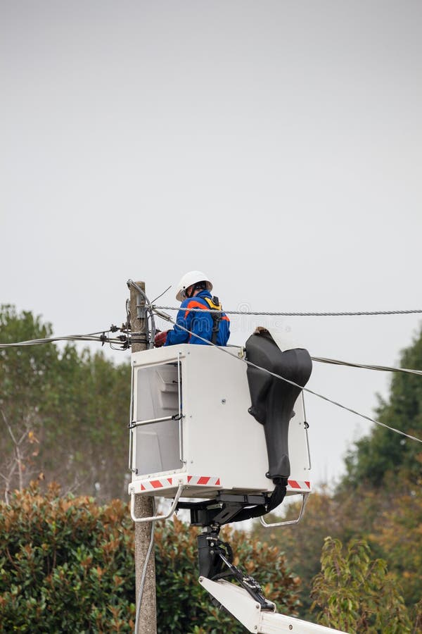 Electrician Working on Aerial Platform for Electrical Maintenance on ...