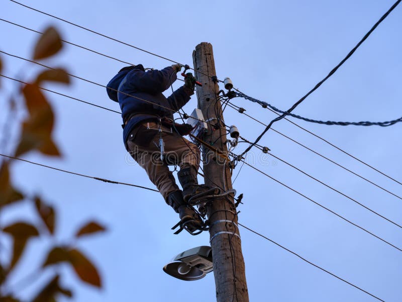 Electrician Working on an Electric Pole Stock Image - Image of ...