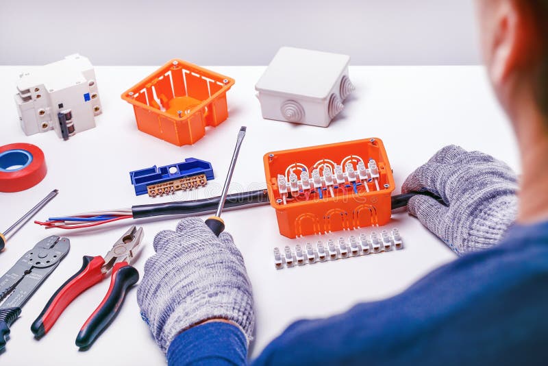 Electrician Working on Electrical Panel. Service Electrical Equipment ...