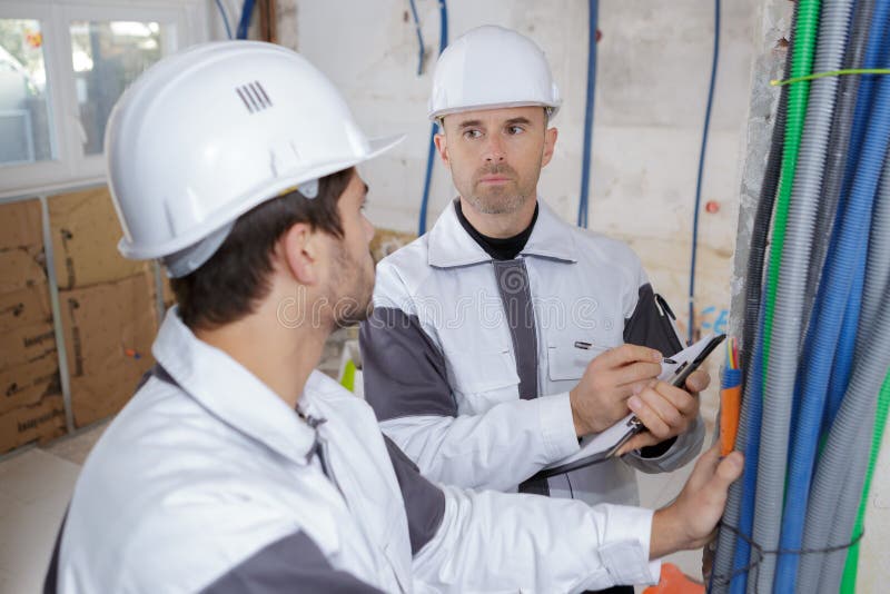 Electrician Working with Indoors Cables Stock Photo - Image of ...