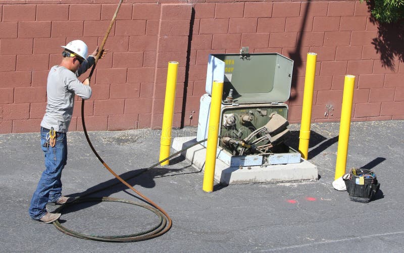 Electrician Pulling Wire into PVC Conduit Stock Photo - Image of live ...
