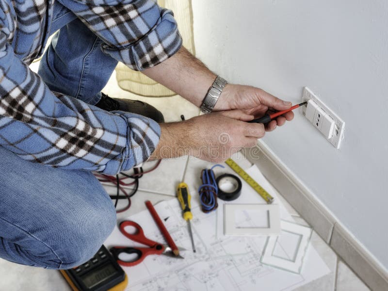 Electrician Working in a Residential Electrical System Stock Photo ...