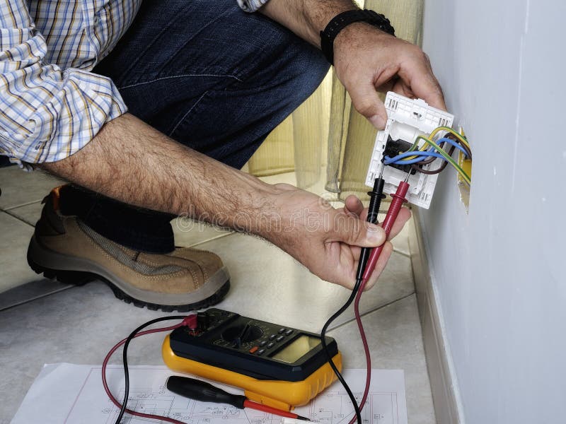 Electrician Working in a Residential Electrical System Stock Photo ...