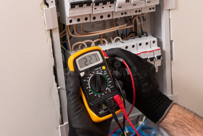 Electrician Works with Electrical Automated. Electrical Switchboard ...