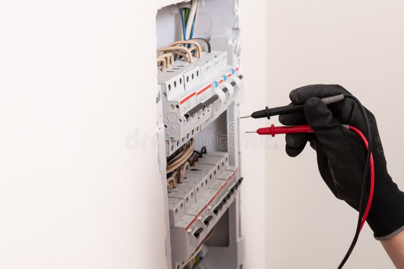 Electrician Works with Electrical Automated. Electrical Switchboard ...