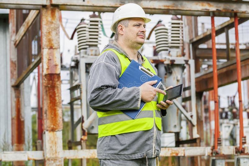 Electrician Writing in Electrical Substation Stock Photo - Image of ...
