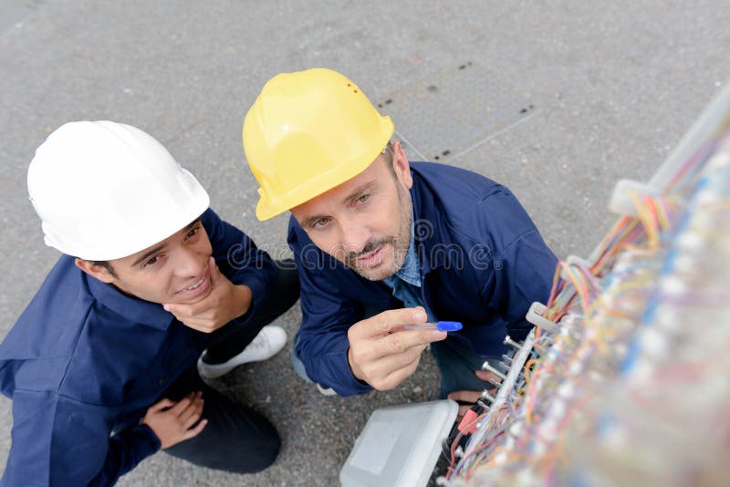 Electricians Checking Control Panel Outdoors Stock Image - Image of ...