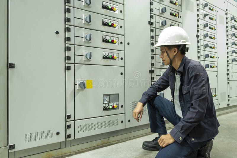 Electricians are Checking Electrical Control Panels in Industrial ...