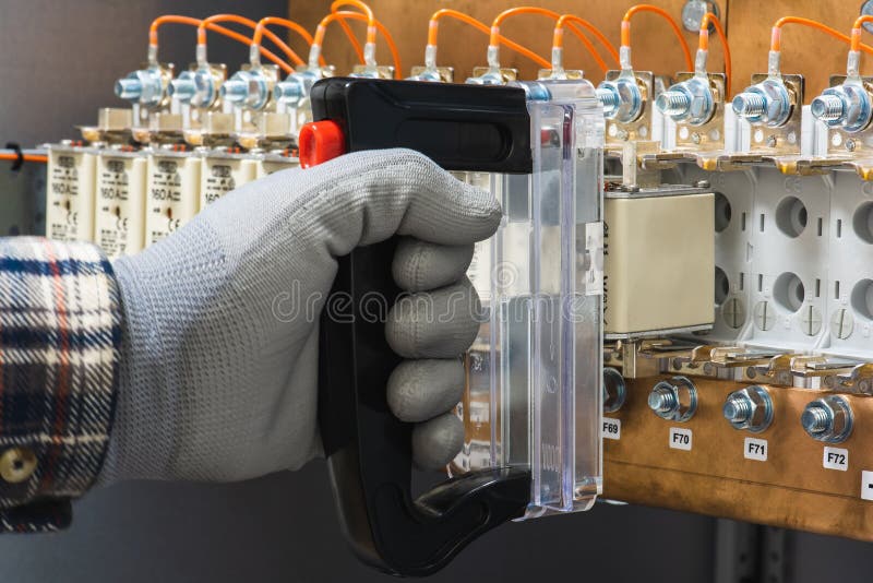 Electricians Hand Installs Breakers in an Electrical Switchboard Stock ...