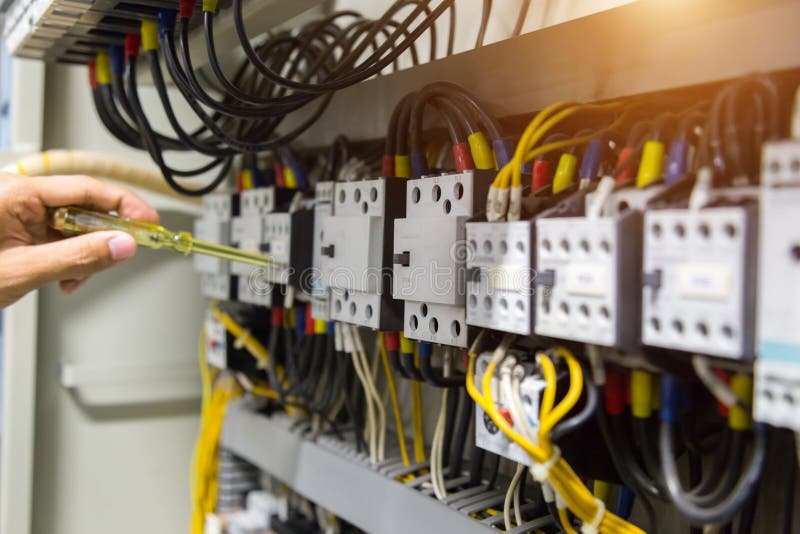 Electricians Hands Testing Current Electric in Control Panel Stock ...