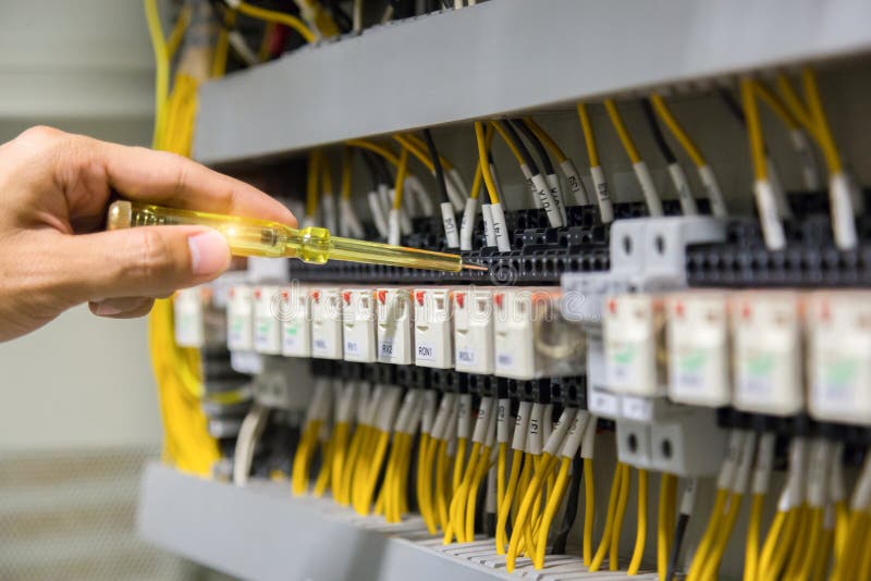 Electricians Hands Testing Current Electric in Control Panel Stock ...