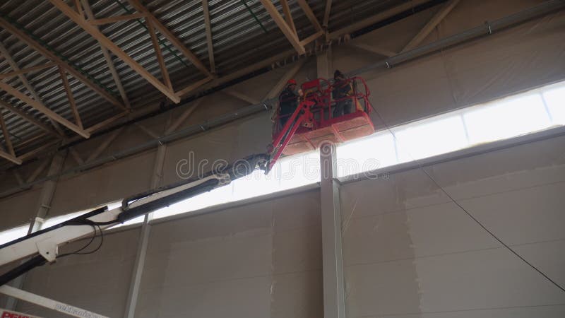 Electricians Install Cable on Ceiling of New Warehouse Stock Video ...