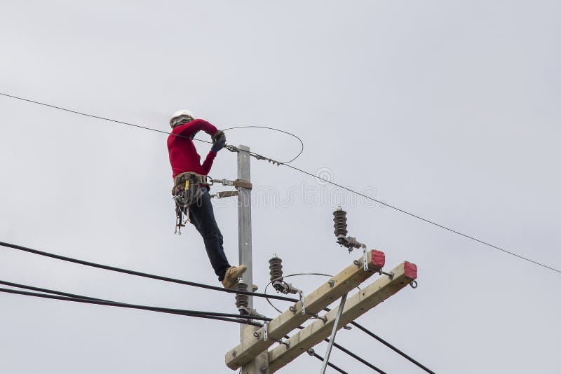 Electricians Install High-voltage Electrical Systems on Electric Poles ...