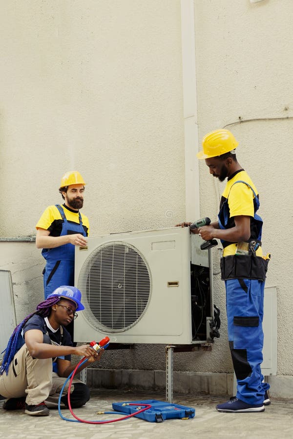 Electricians Installing Condenser Stock Photo - Image of technician ...