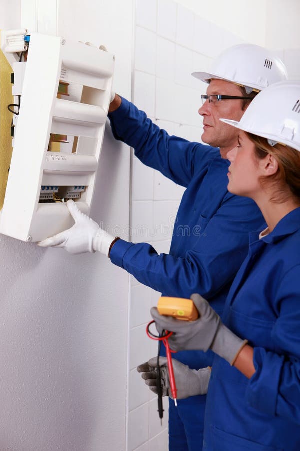Electricians Installing a Fusebox Stock Photo - Image of house, button ...
