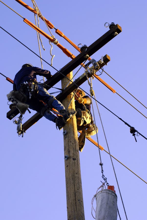 Electricians on Pole stock photo. Image of afternoon, pole - 4993612
