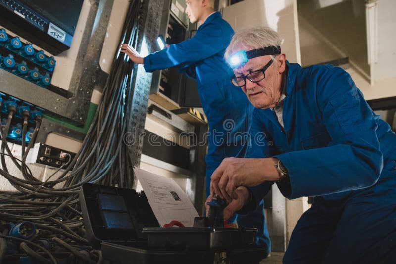 Electricians Fixing a Switch Board Stock Photo - Image of component ...