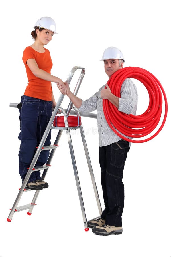 Electricians shaking hands stock image. Image of engineer - 27188031